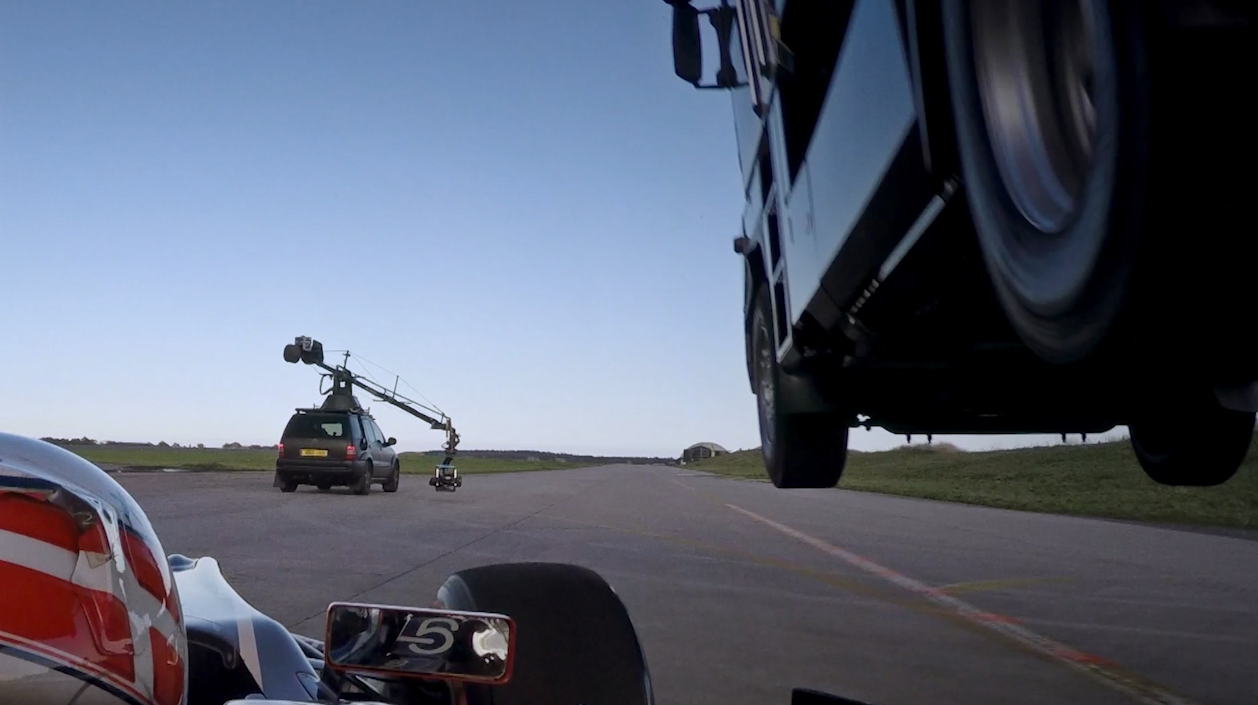 Semi Truck Jumps F1 Car