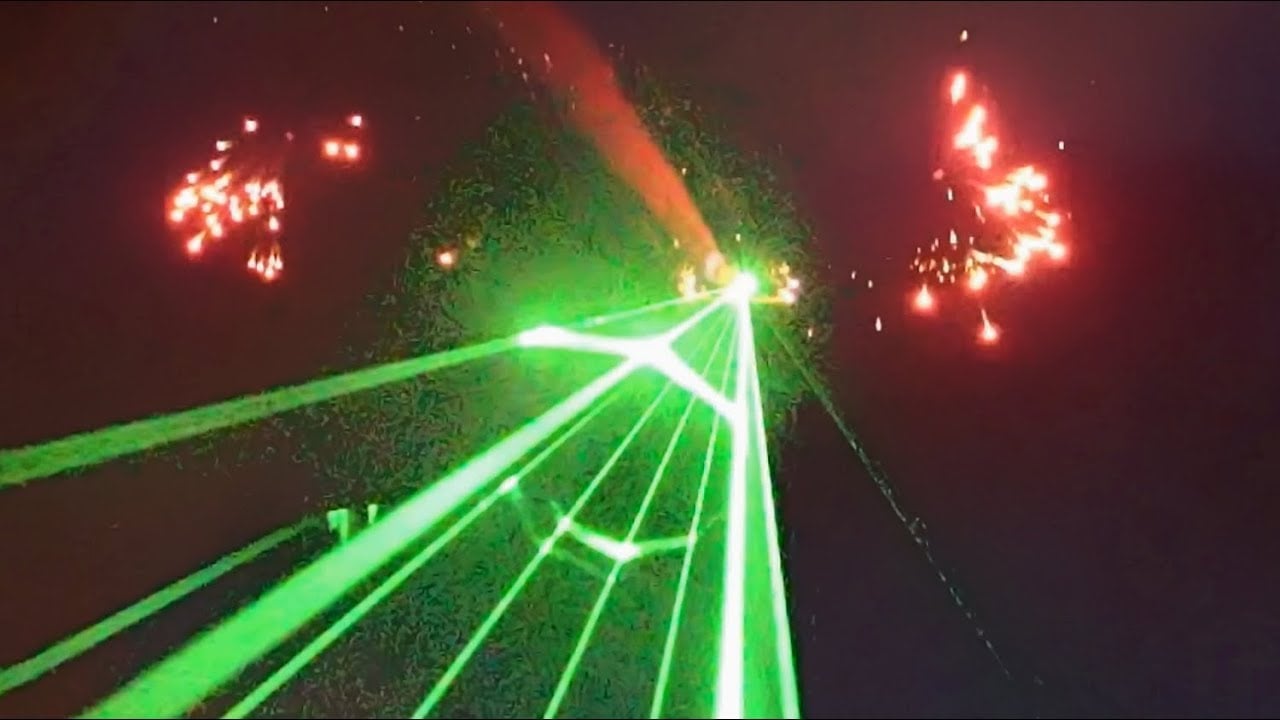 Watch a Stunt Plane Fire Lasers and Fireworks While it Flips and Rolls