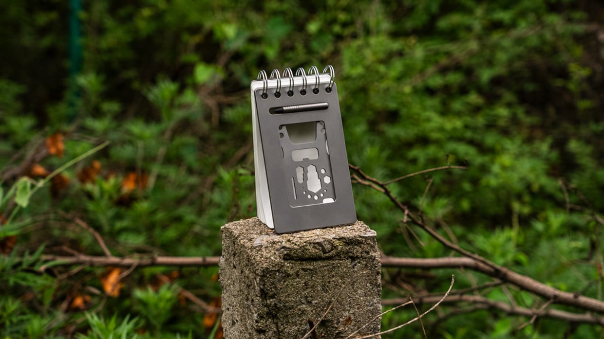 TIX Note Titanium Notebook Handles Rain and Mud and Even Opens Bottles