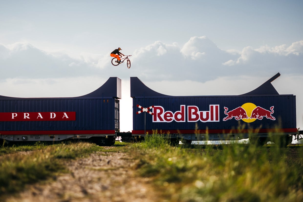 MTB Rider Does Bike Tricks on a Moving Train