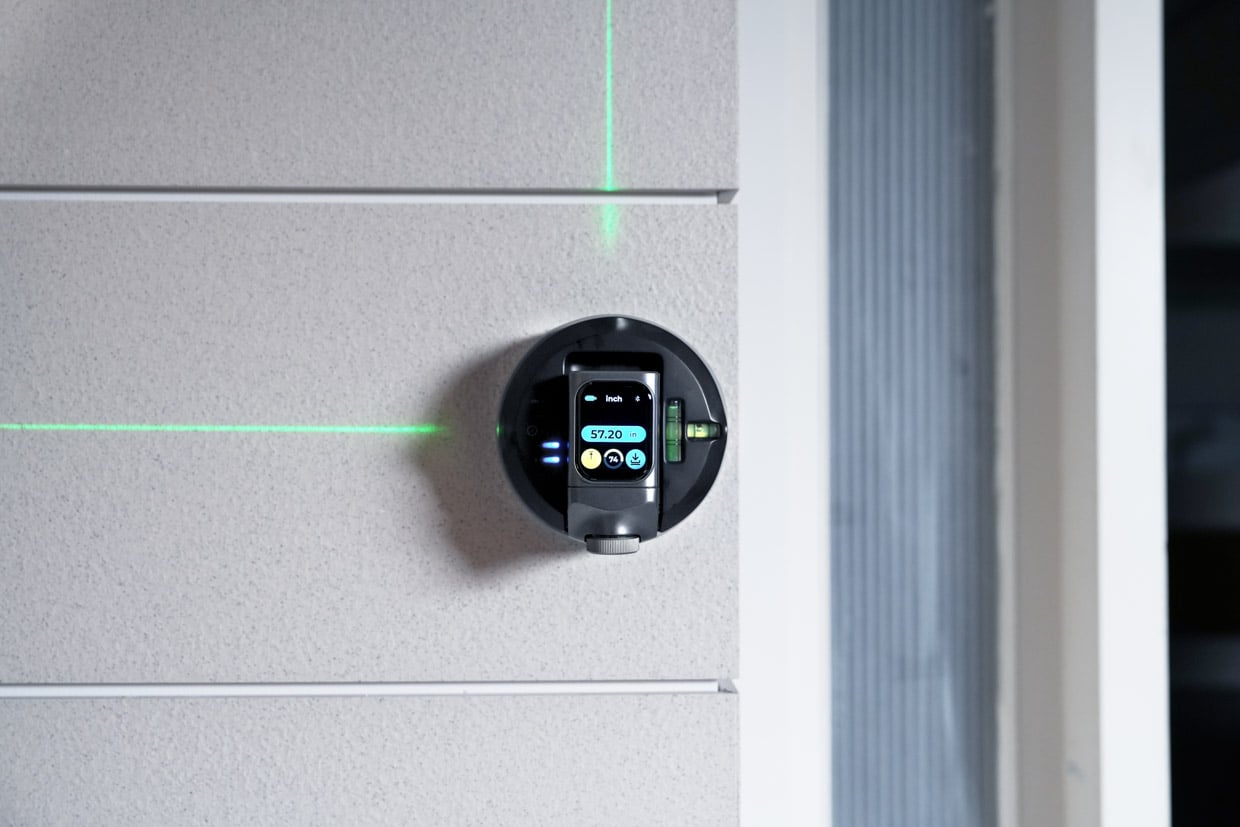 The M-Cube 02 Laser Level Sticks to Any Wall and Can Measure Too