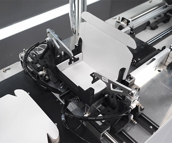 Watch This Homemade Machine Fold, Fill, and Close Boxes in Seconds