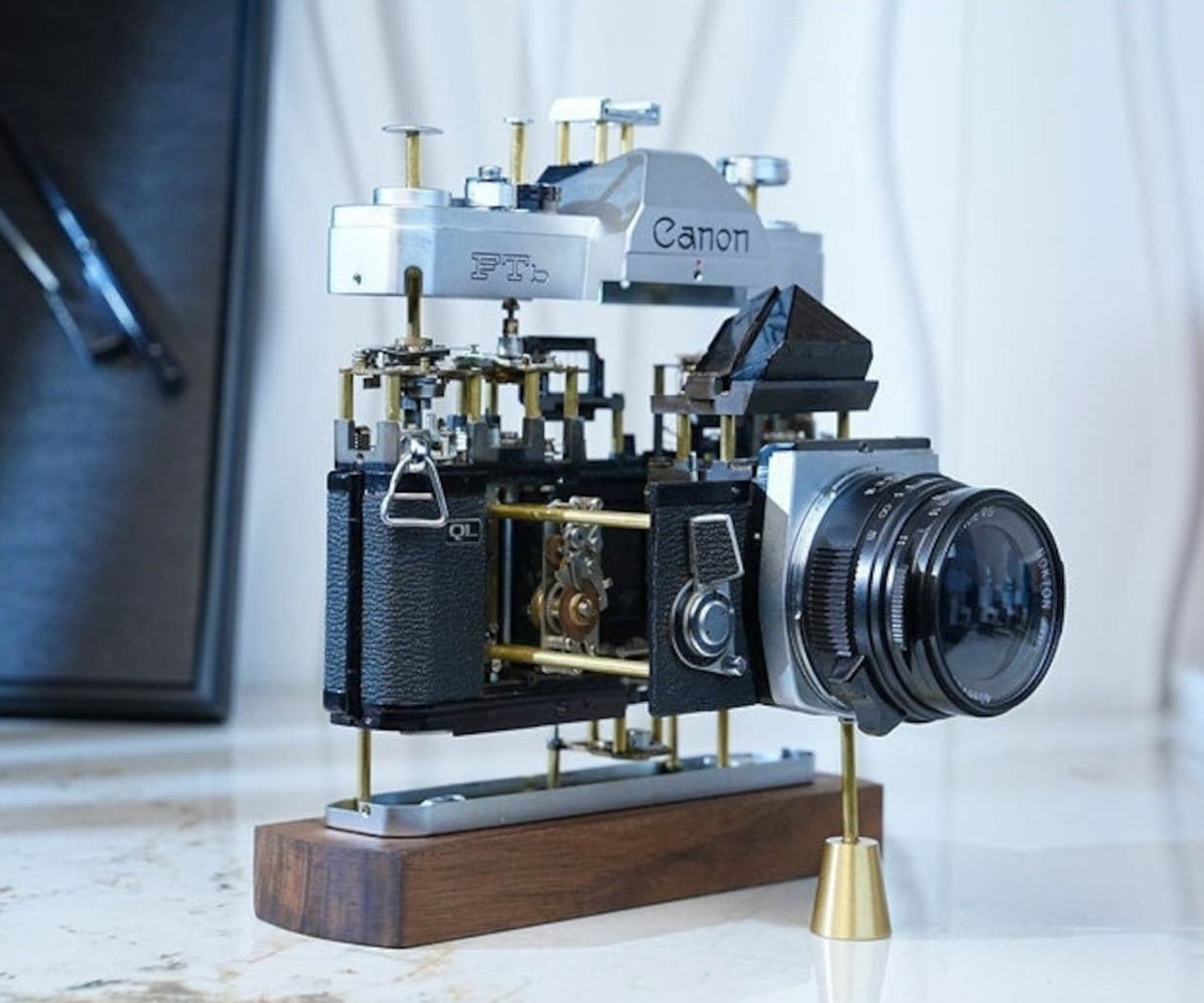 Turning Disassembled Vintage Cameras into Art