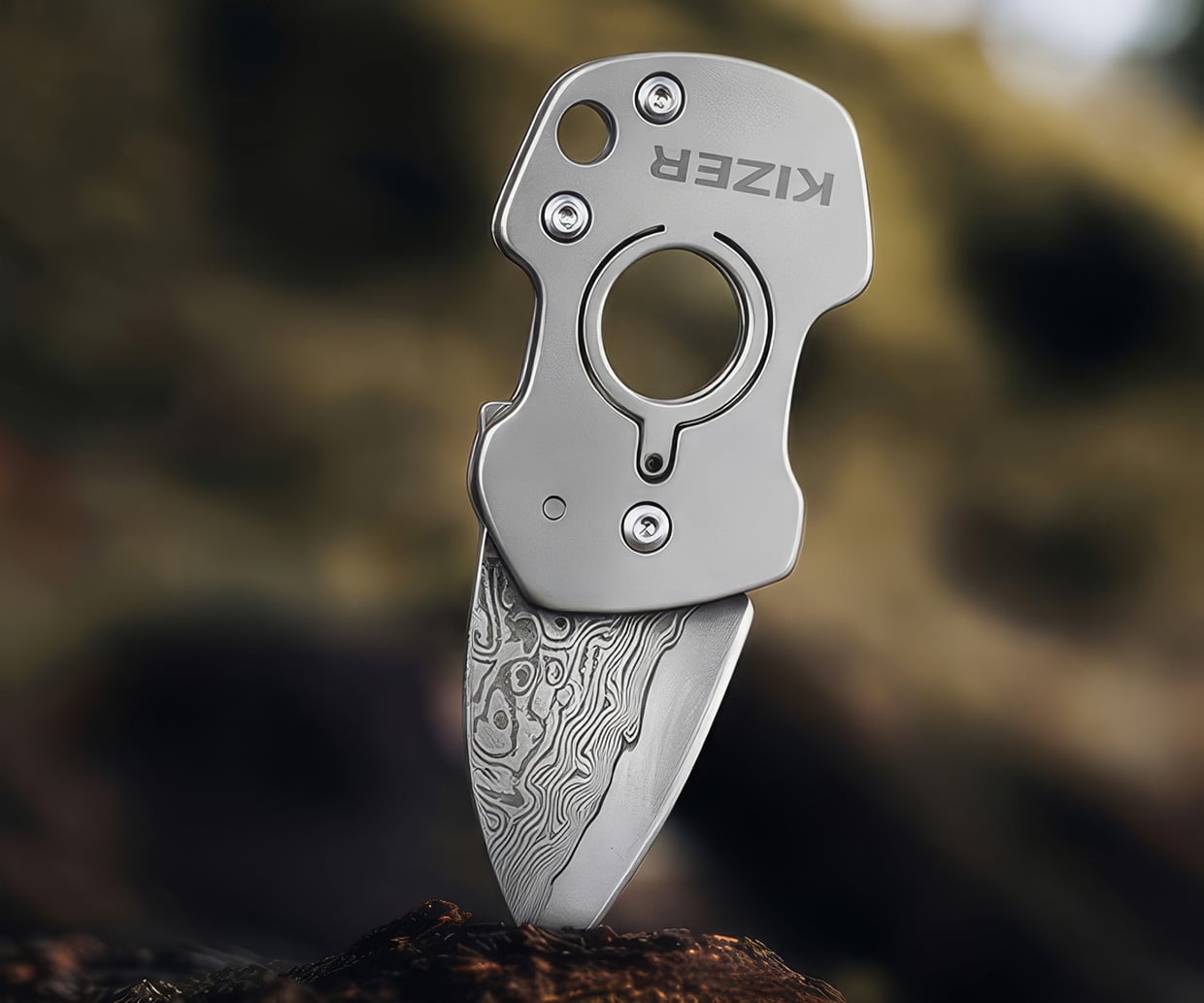 Kizer’s Stubby Titanium Knife Packs a Damascus Shark Fin Blade